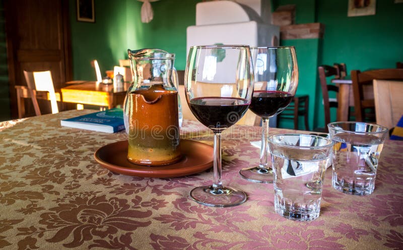 Glass of Red Wine on a Table in Rustic Restaurant. Stock Image - Image ...