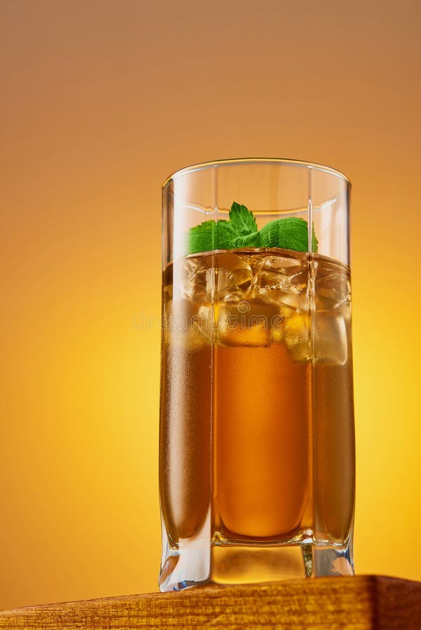 A Glass of Refreshing Iced Tea with Ice Cubes and Mint Leaves. Studio ...