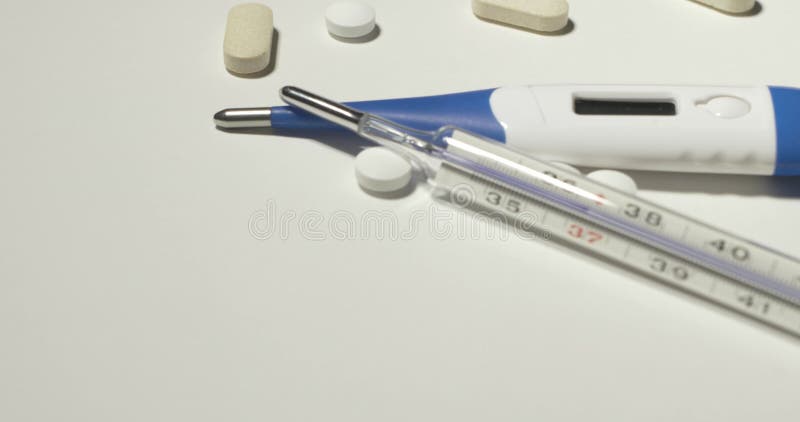 Glass Rising Thermometer and New Digital Thermometer with Drugs Stock ...