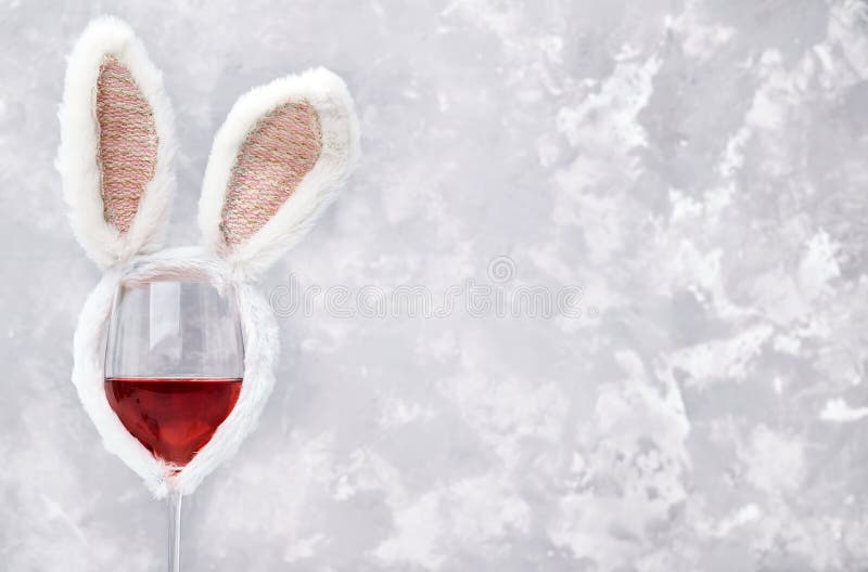 Glass of Rose or Red Wine with Bunny Ears on Bright Background. Easter ...