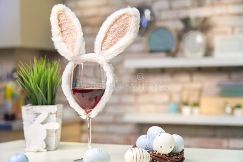Glass of Rose or Red Wine with Bunny Ears and Easter Decorations ...