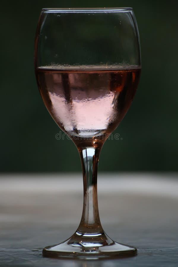 Glass of rose wine stock photo. Image of tableware, dinner - 188662350