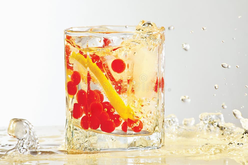 Glass of Rum, Ice, Lemon and Cranberry with Splash Stock Photo - Image ...