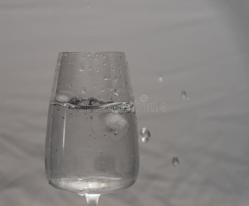 Glass with Running Clean Water and Gray Background Stock Image - Image ...
