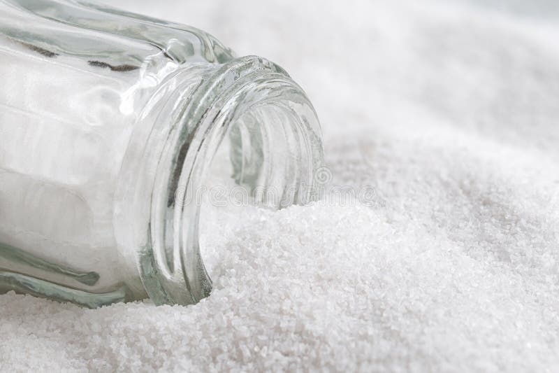 Glass Salt Shaker Lying on Top of Sea Salt Stock Photo - Image of ...