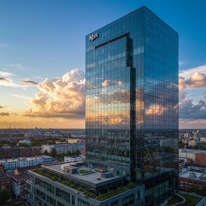 Glass Skyscraper Reflecting a Colorful Sunset Sky with Scattered Clouds ...