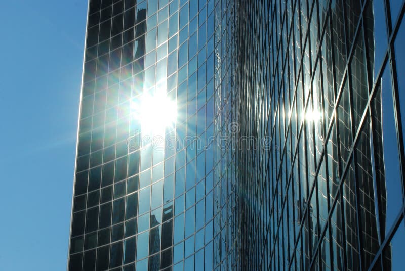 A Glass Skyscraper with the Sun Glistening Stock Image - Image of urban ...