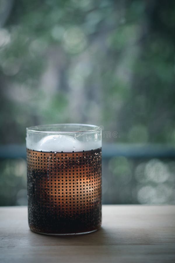 Glass of Soft Drink with Ice Ball in a Glass Stock Photo - Image of ...