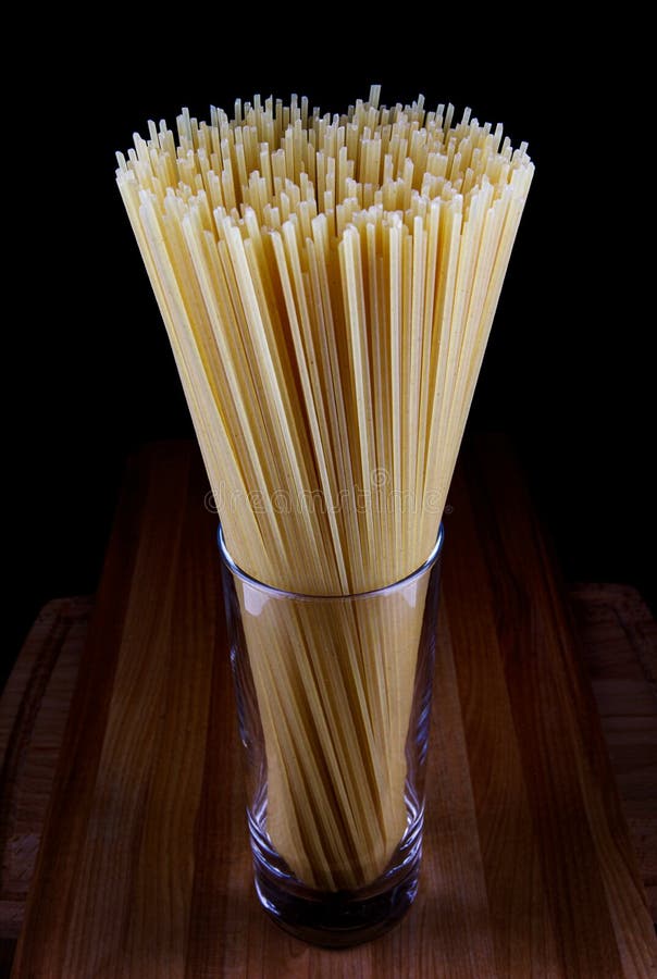A Glass of Spaghetti Stands on a Wooden Board Stock Photo - Image of ...