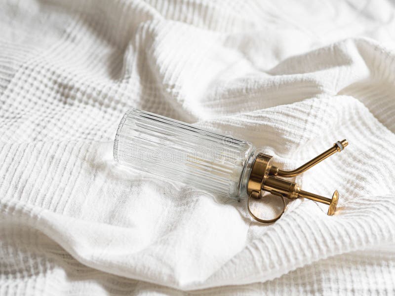 Glass Spray Perfume on a White Cloth Stock Photo - Image of water ...
