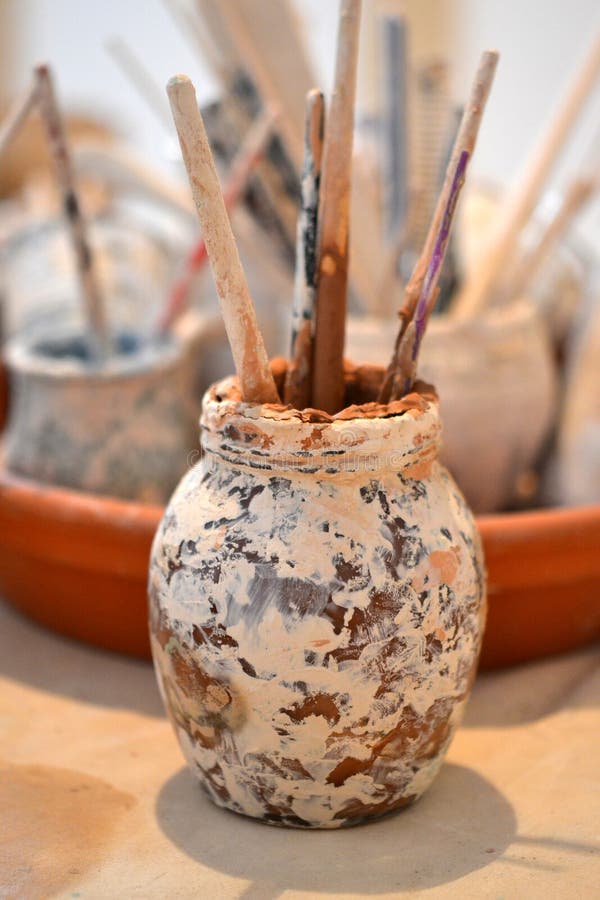 A Glass Stained with Smeared Clay with Tassels Stock Image - Image of ...