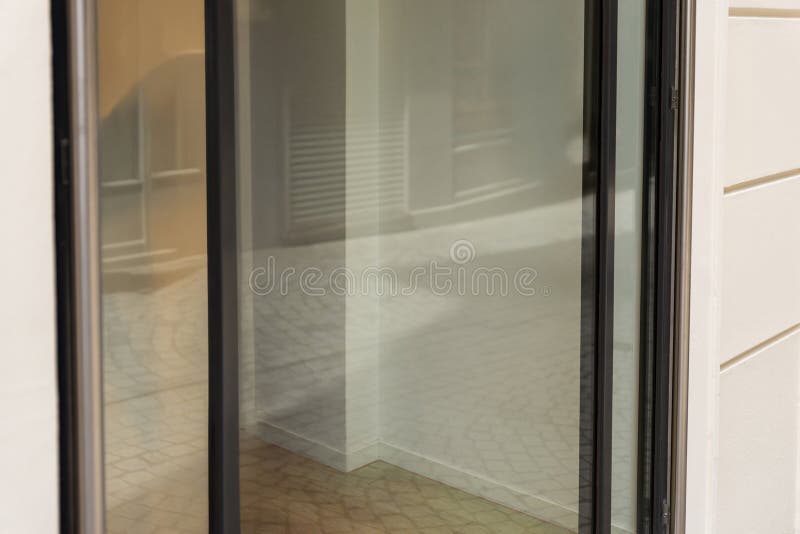 Glass Storefront with Empty Interior and Soft Street Reflections Stock ...