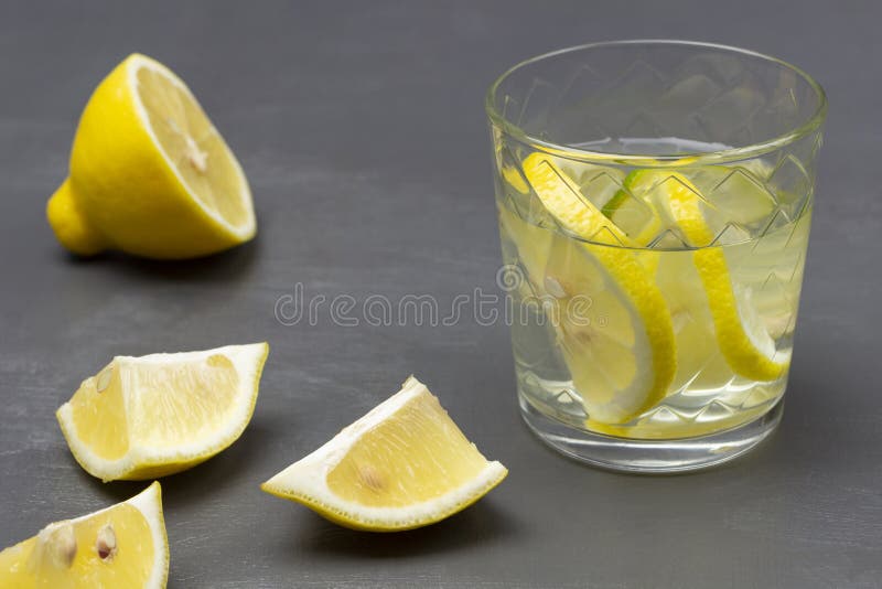Glass with Summer Lemon Drink. Lemon Slices on Table Stock Photo ...