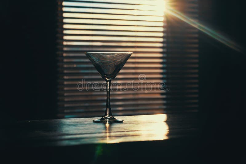 Glass in the sun rays stock photo. Image of shutters - 81017306