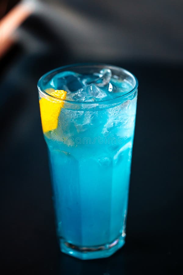 Sweet Cool Blue Cocktail with Lemon and Ice Stock Photo - Image of ...