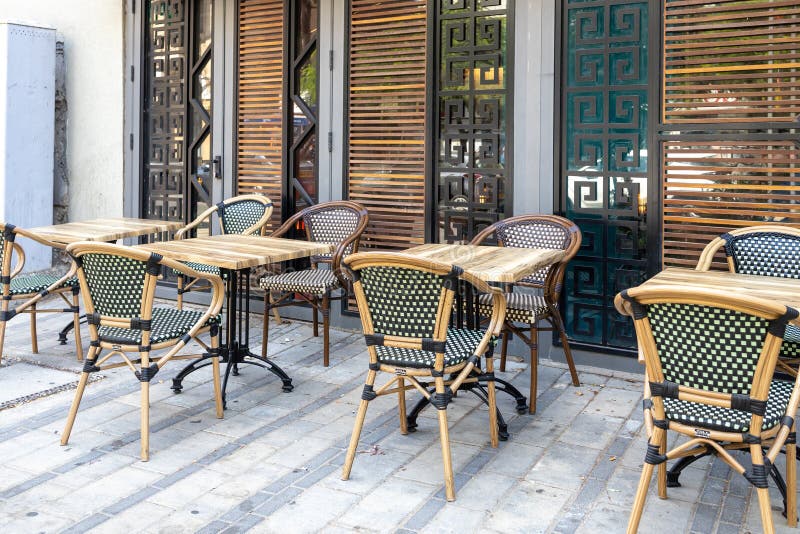 Glass Tables and Wicker Chairs in a Street Cafe Stock Image - Image of ...