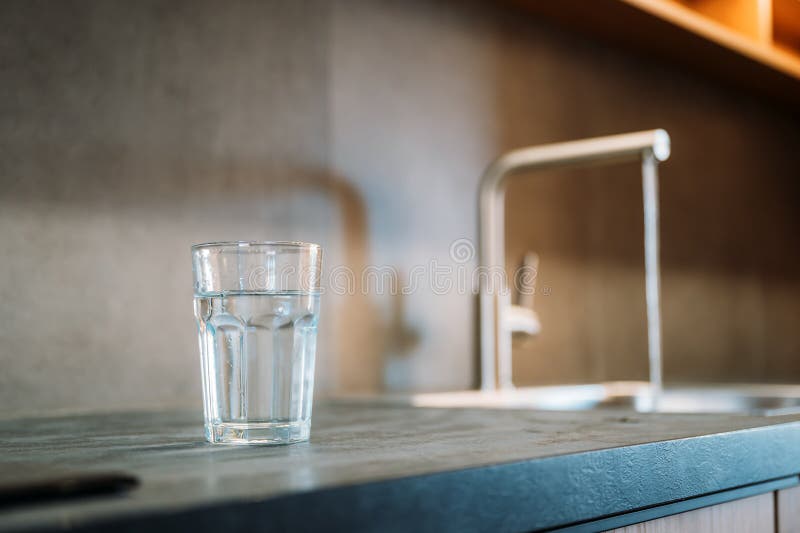 Glass of Tap Water on Kitchen Counter Top Stock Image - Image of faucet ...