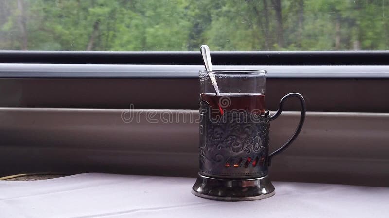Glass of Tea on a Train Compartment Table. Stock Video - Video of ...