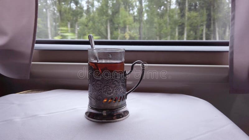 Glass of Tea on a Train Compartment Table. Stock Video - Video of ...