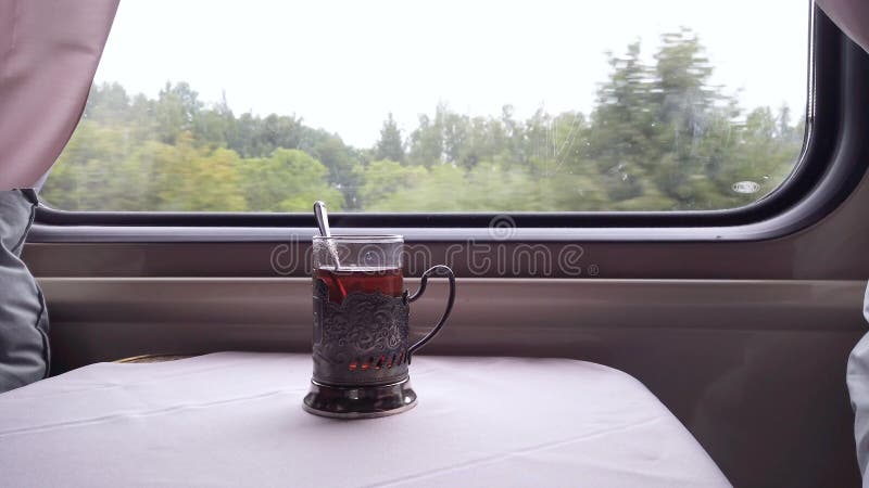Glass of Tea on a Train Compartment Table. Stock Footage - Video of ...