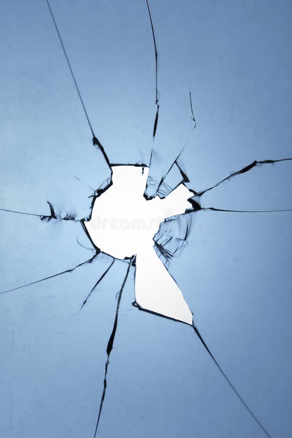 Glass Texture of a Broken Window with a Hole and Cracks on a Blue ...