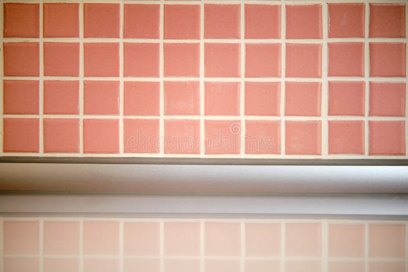 Glass Tile Background Divided in Half Reflected in a Mirror Surface ...