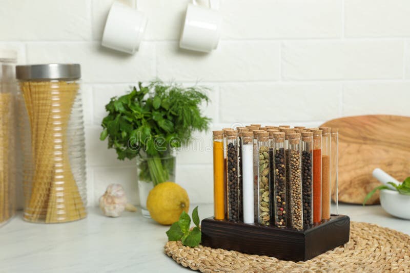 Glass Tubes with Different Spices on Kitchen Counter Stock Image ...