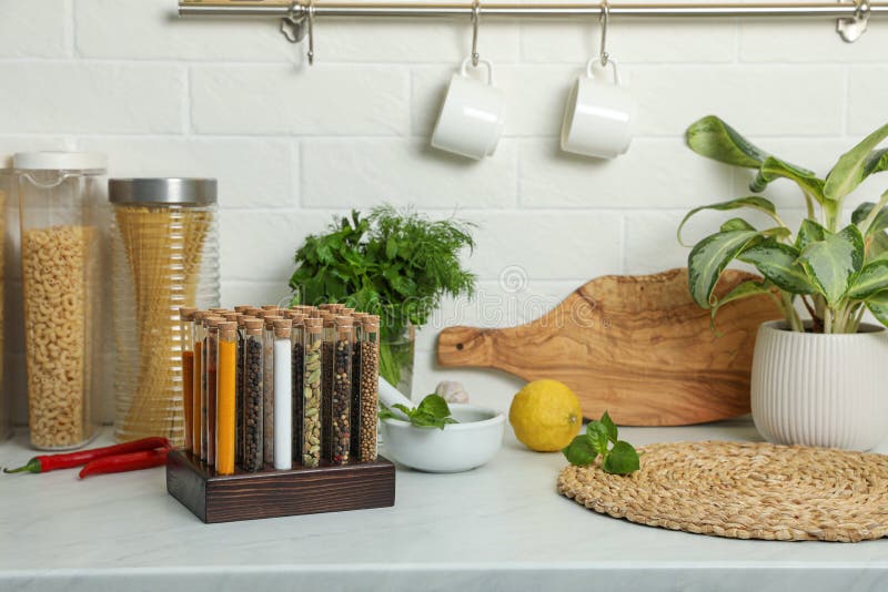 Glass Tubes with Different Spices on Kitchen Counter Stock Image ...