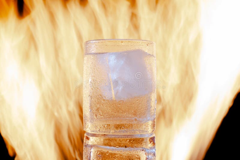 Glass with Vodka and Ice Against the Flames Stock Image - Image of ...