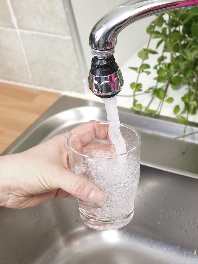 Glass Filled with Drinking Water from Kitchen Faucet. Stock Image ...