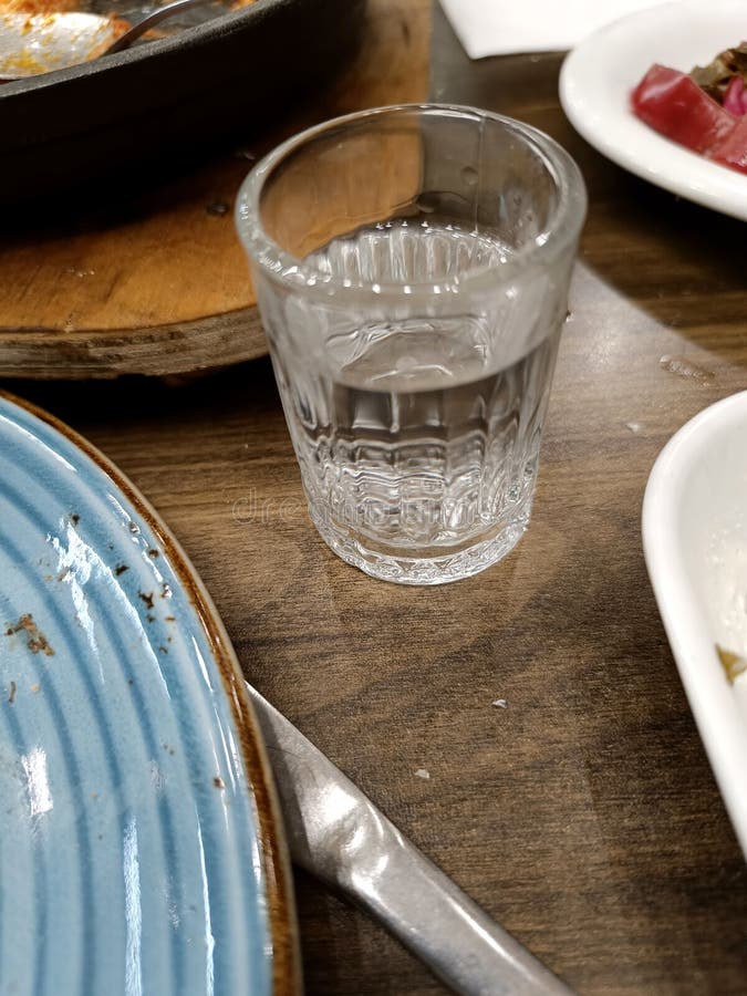 A Glass of Water or a Glass of Alcoholic Beverage on the Dinner Table ...