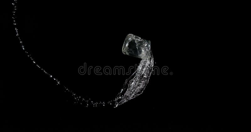 Glass of Water Bouncing and Splashing on Black Background Stock Photo ...