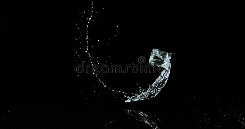 Glass of Water Bouncing and Splashing on Black Background Stock Photo ...