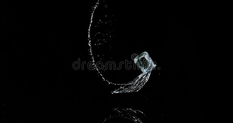 Glass of Water Bouncing and Splashing on Black Background Stock Photo ...