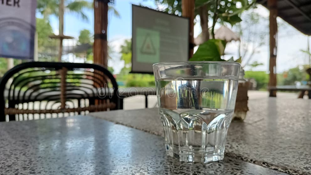 A Glass of Water on the Dining Table Stock Image - Image of lighting ...