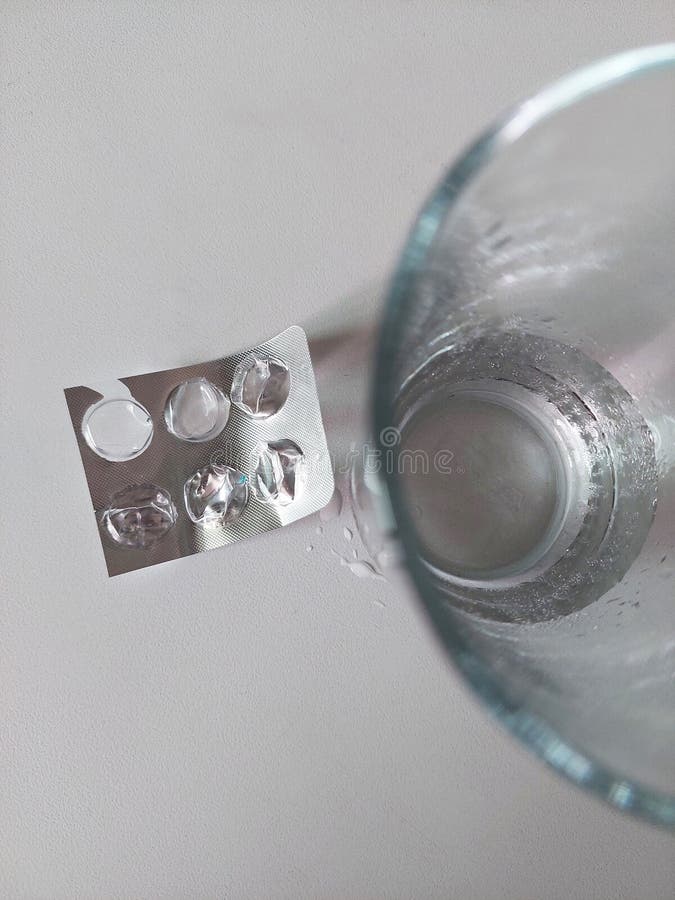 A Glass of Water and Empty Blister Pack. Stock Photo - Image of ...