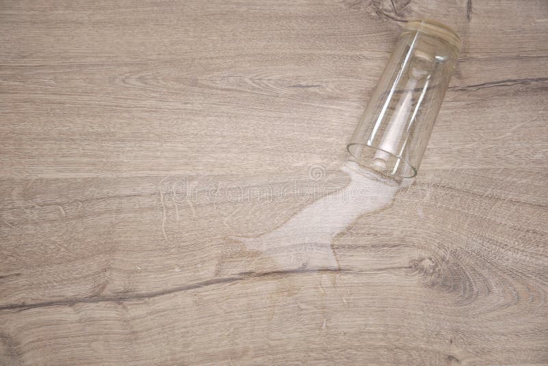 Glass of Water Fell on Laminate, Water Spilled on Floor Stock Image ...