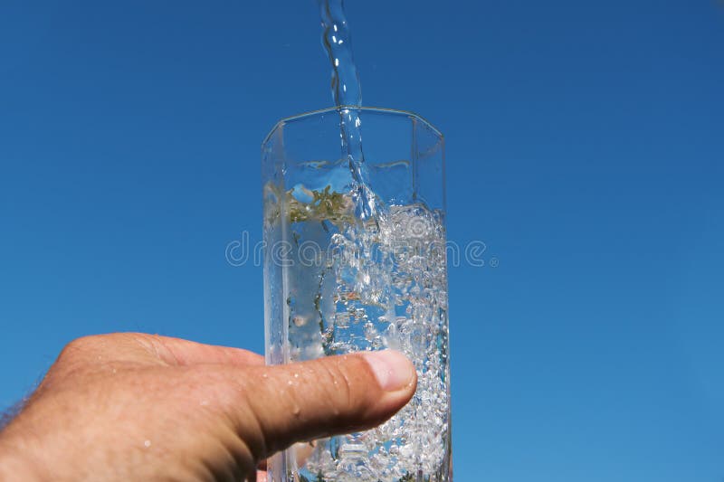 Glass of water. stock photo. Image of food, healthy, hand - 32293876