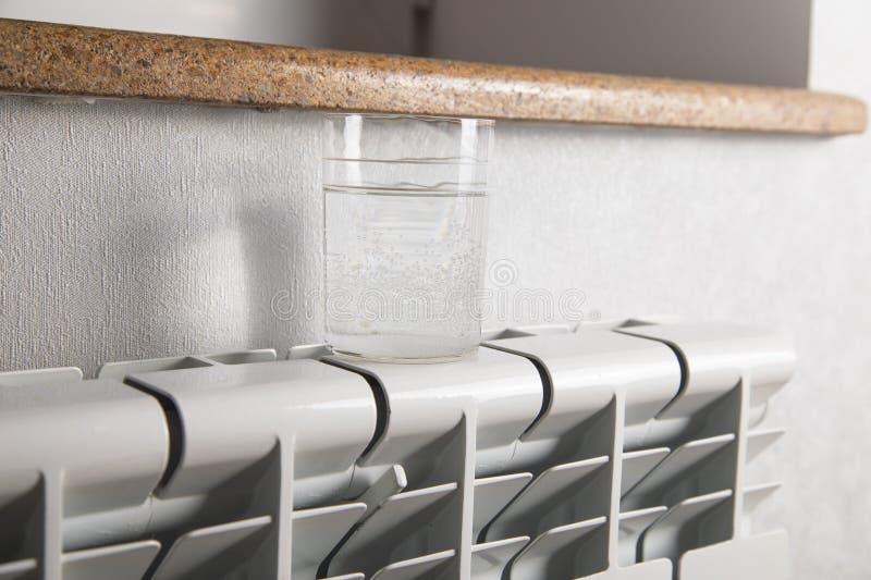 Glass of Water on Heating Radiator Stock Image - Image of refreshing ...