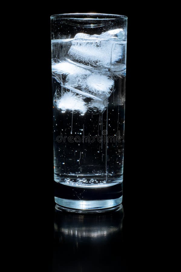 Glass of Water with Ice Cubes Dropped in Stock Photo - Image of cold ...