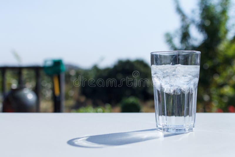 A Glass of Water with Ice on the Table. Stock Image - Image of glass ...