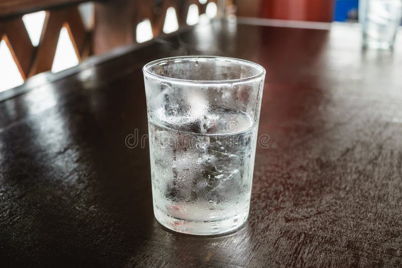 A Glass of Water with Ice, on the Table. Stock Photo - Image of ...