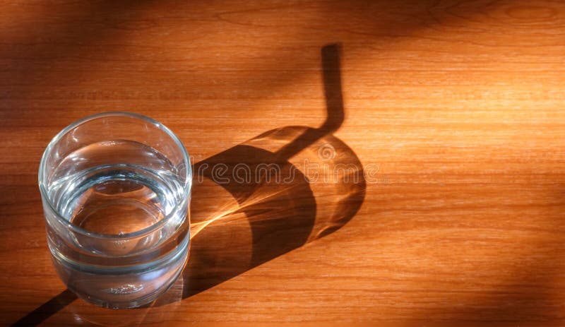 Glass of Water on with Light and Shadow. Stock Photo - Image of bright ...