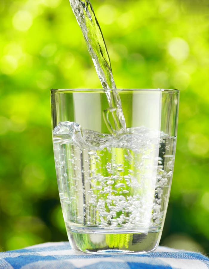 Glass Of Water On Nature Background Stock Images - Image: 28137734