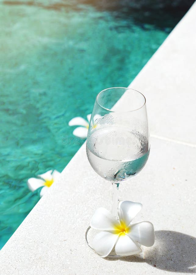 Glass of Water Refreshment Drink on a Pool Side Stock Image - Image of ...