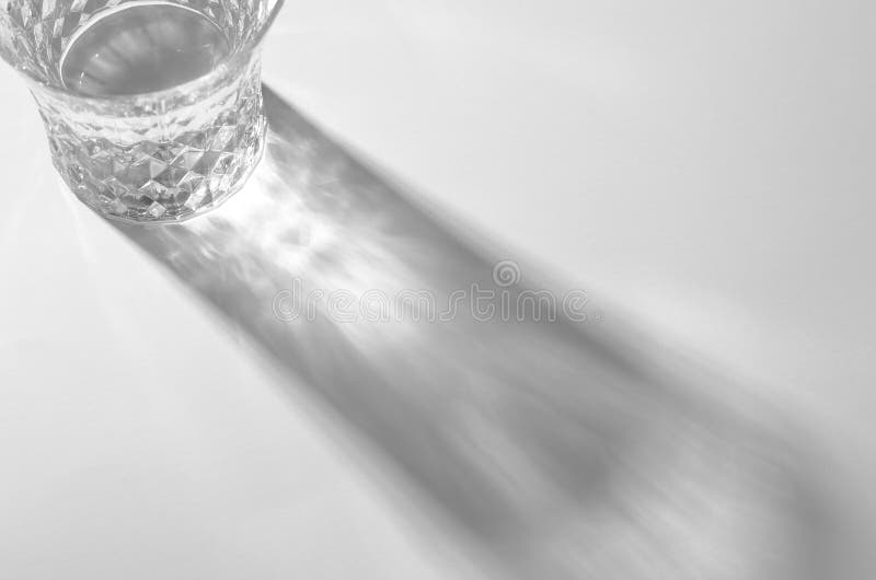A Glass with Water and Sharp Shadows, Caustic Effect As Light Passes ...