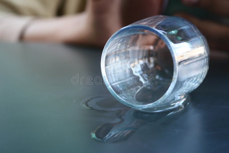 A Glass of Water Spilled on a Table , Stock Photo - Image of splashing ...
