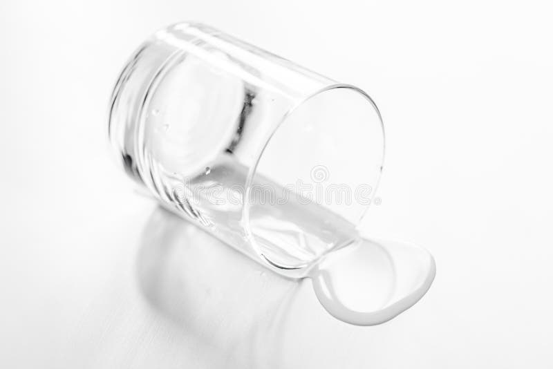.a Glass of Water Spilled on a White Table- Image Stock Image - Image ...