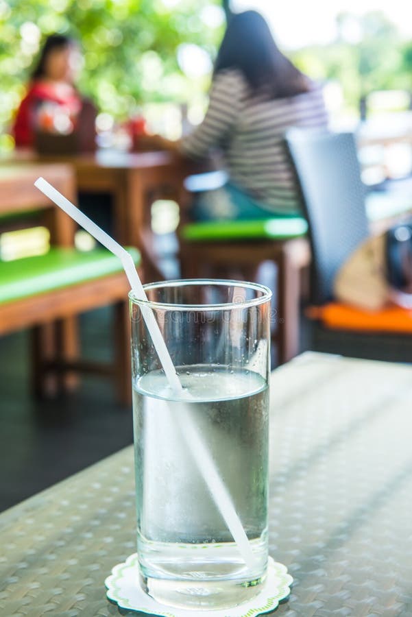 Glass with water on table stock photo. Image of cloth - 172555960