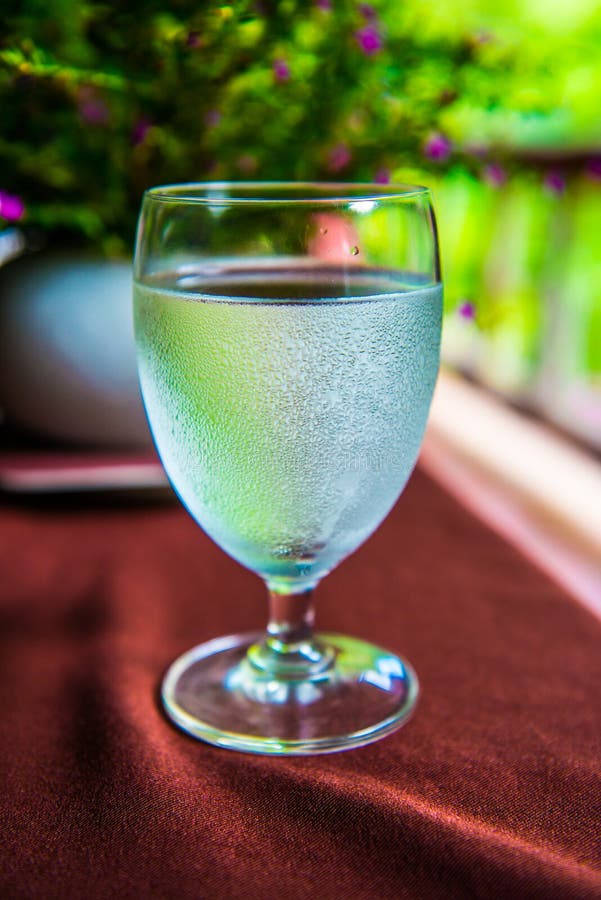 Glass with water on table stock image. Image of thai - 217667409